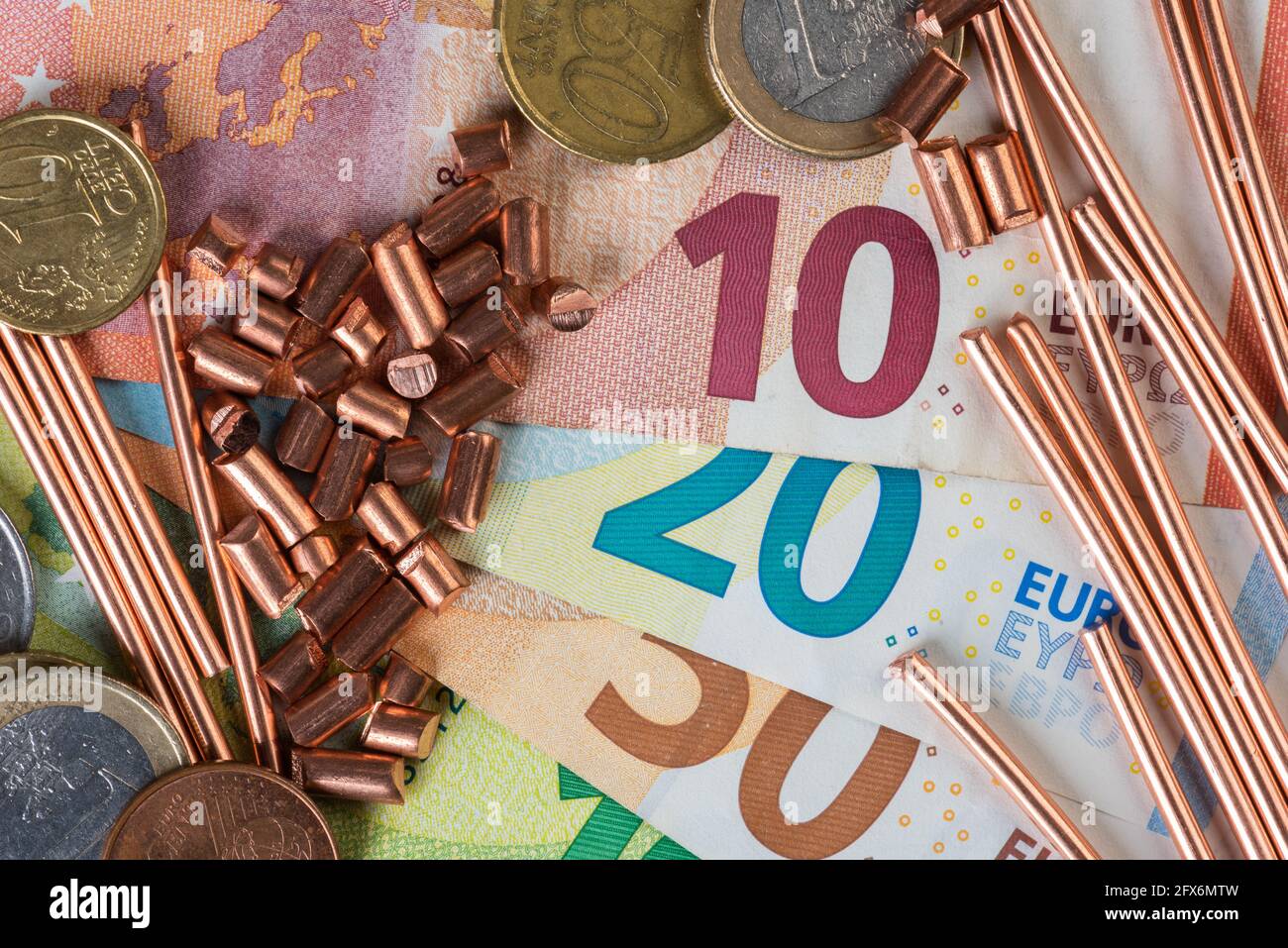 Euro banknotes, coins and scrap of copper wire top view, trading and ...