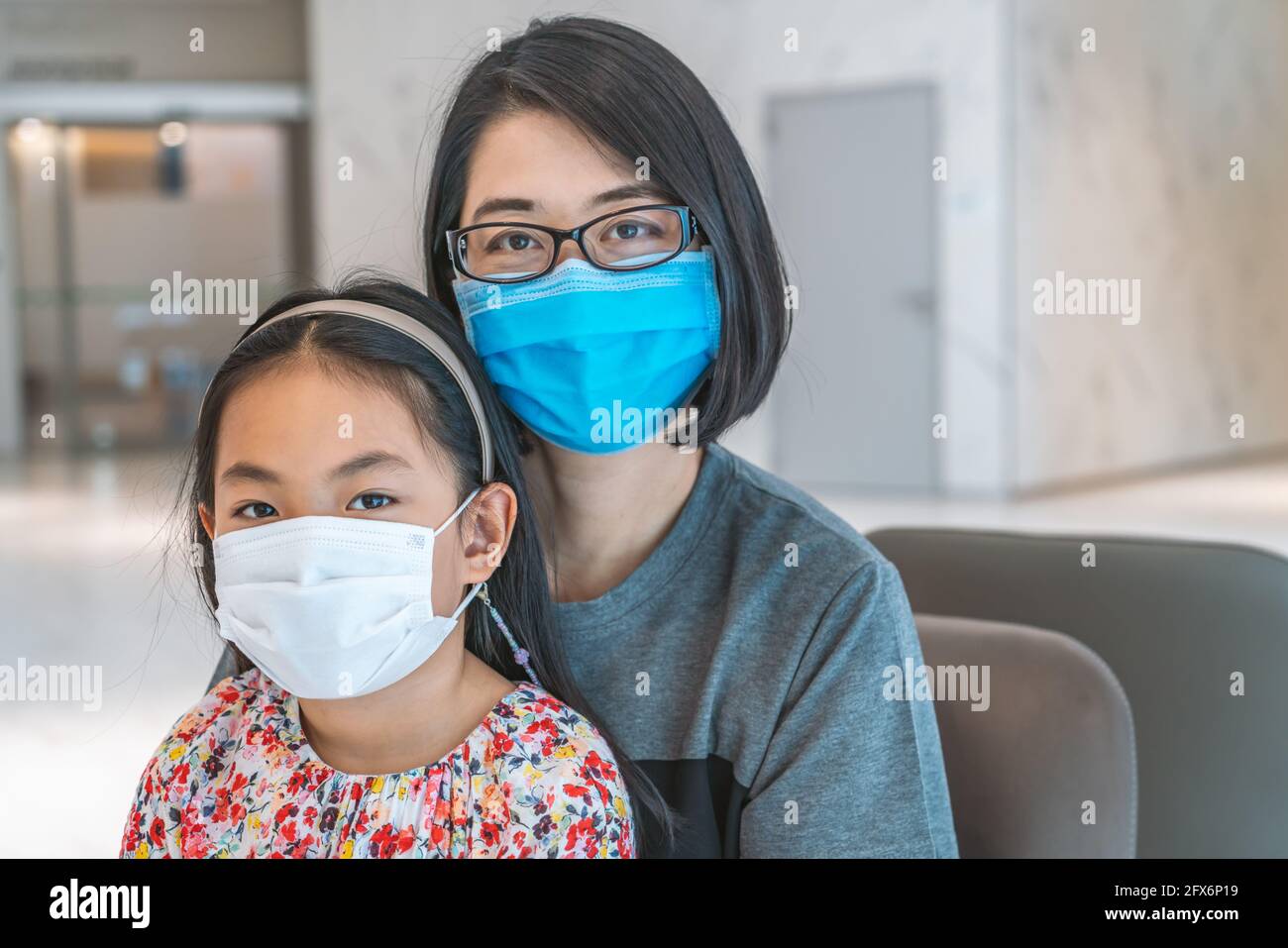 Portrait Asian mother with eyeglasses, middle-aged woman, and daughter ... Portrait Asian mother with eyeglasses, middle-aged woman, and daughter ...