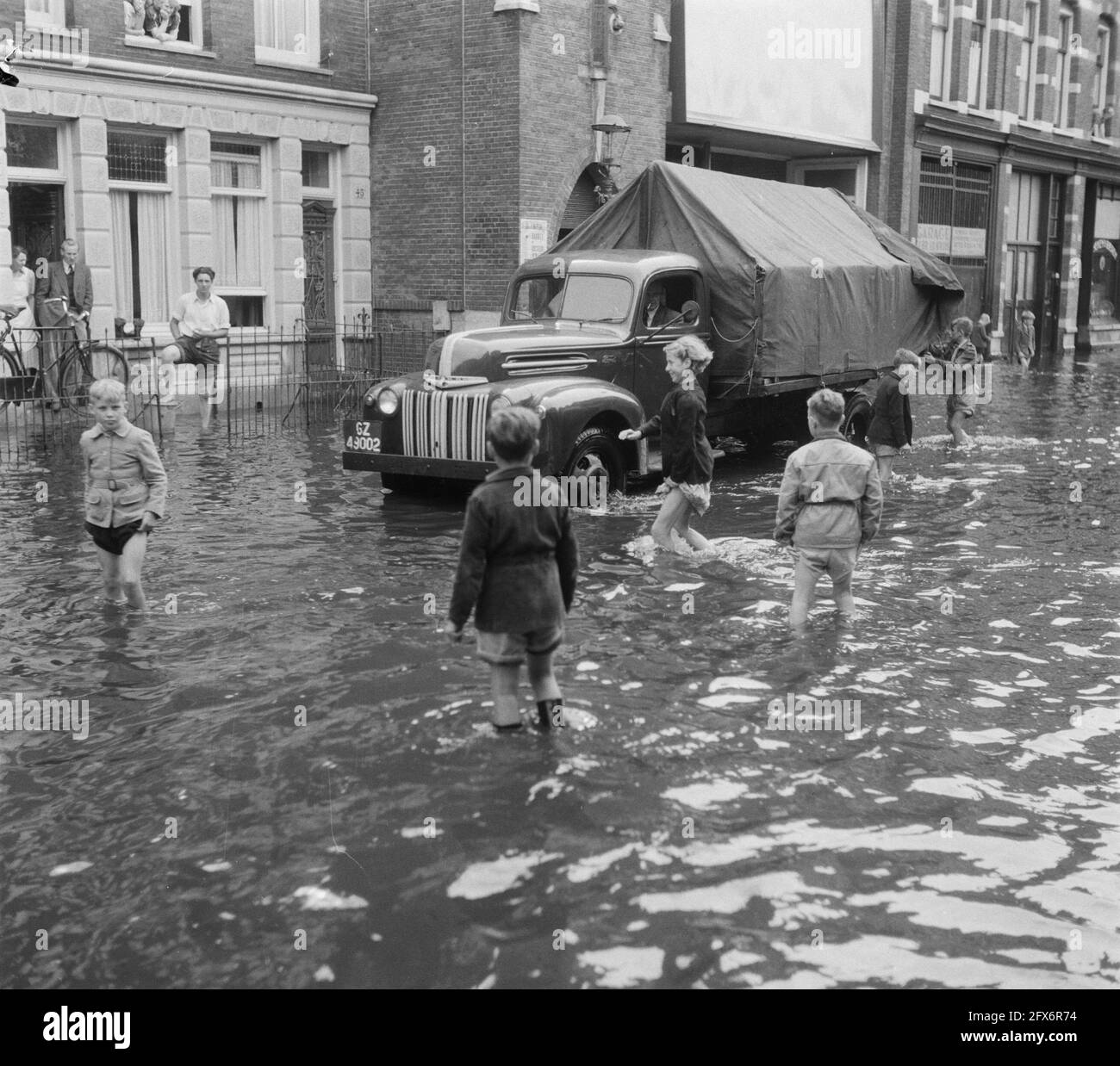 High tide in Amsterdam. Flooded streets. Children, August 9, 1951 ...