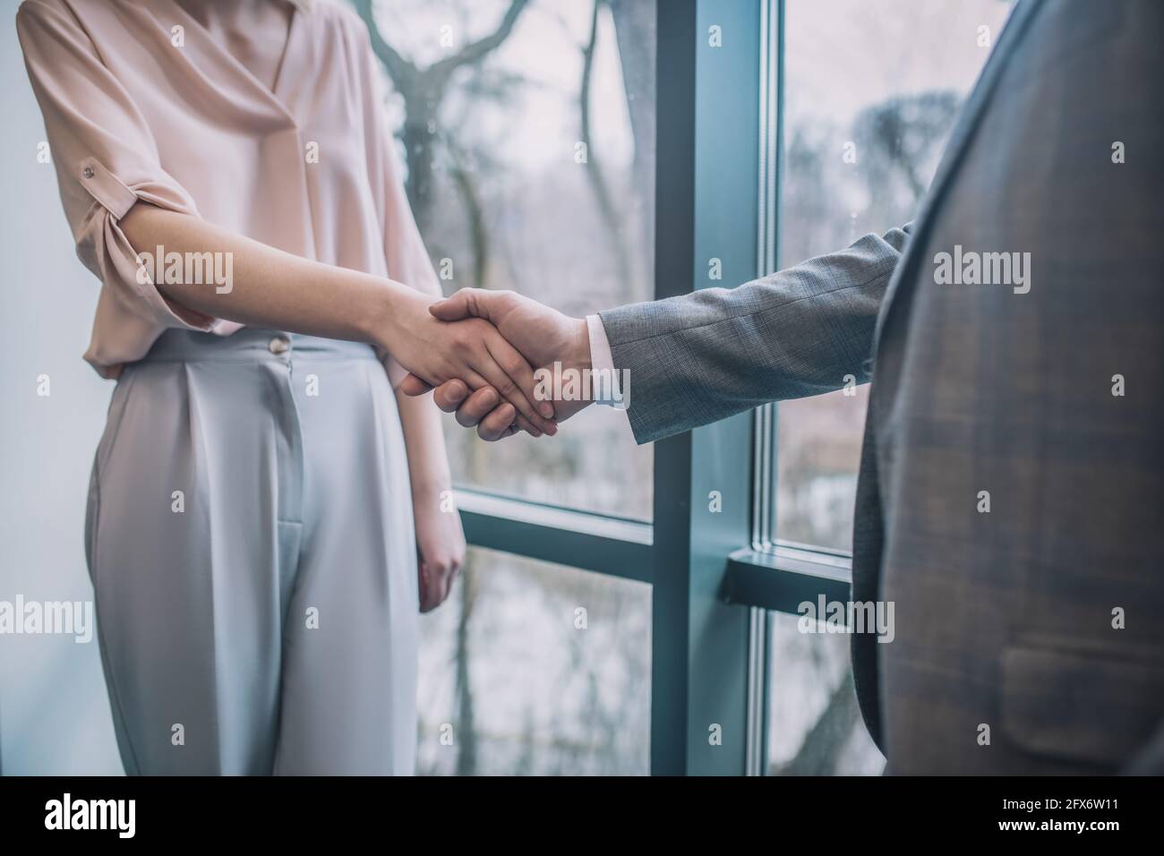 Two business partners signing agreement hi-res stock photography and ...