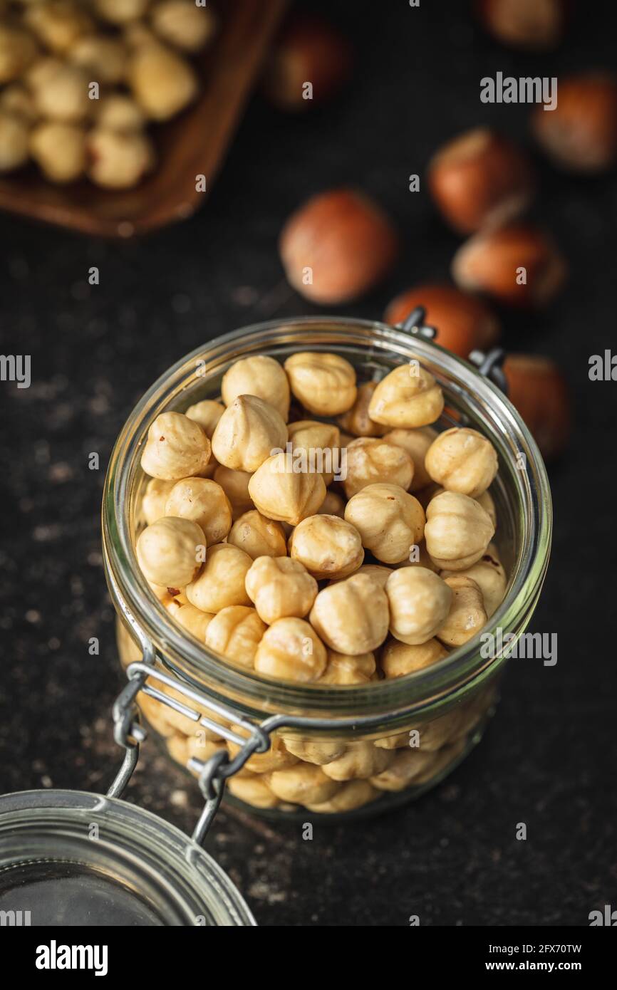 Peeled roasted hazelnut kernels in jar Stock Photo - Alamy