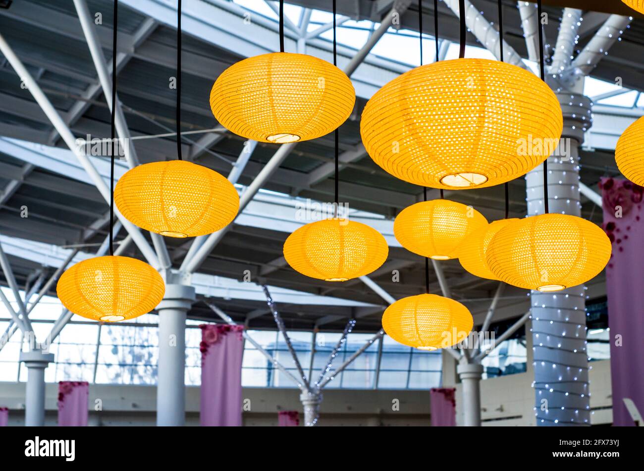 Paper yellow lamps on an industrial gray background. Modern interior ...