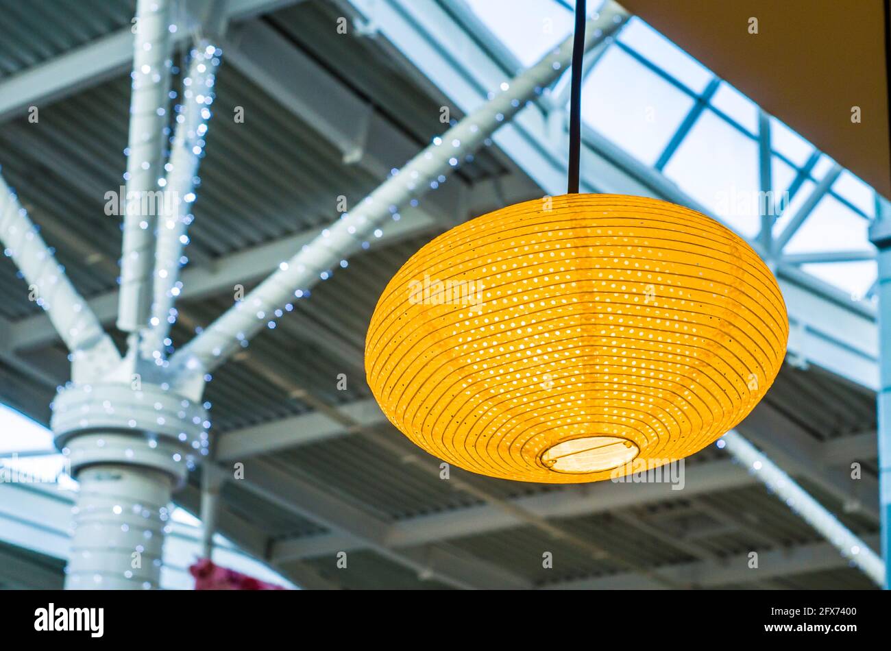Paper yellow lamps on an industrial gray background. Modern interior ...
