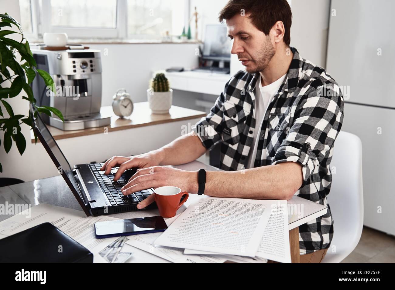 Man working at home office with laptop. Online business concept. Remote ...