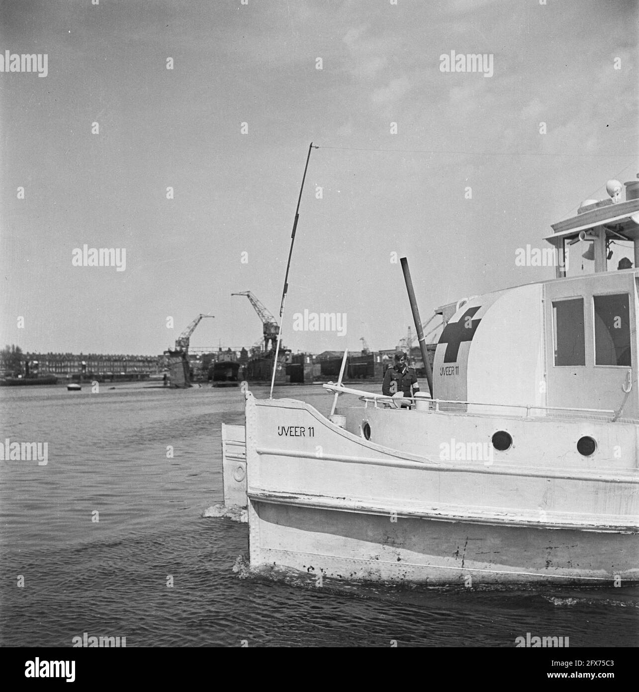 IJveer 11 as Red Cross boat At the plaza stands a German soldier with ...