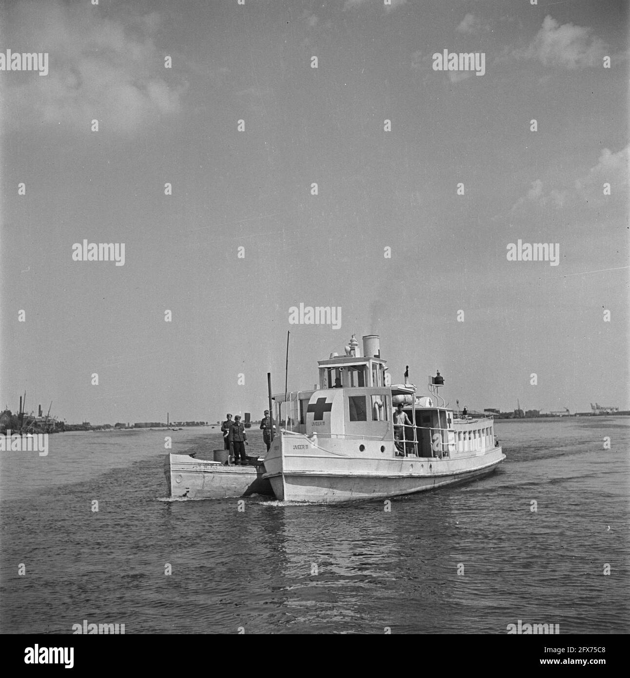 IJveer 11 as Red Cross boat with small ship with German soldiers ...