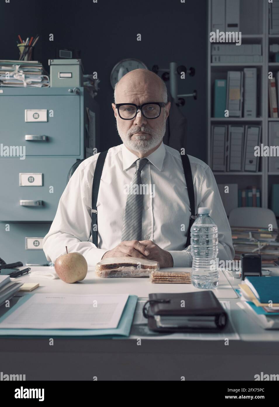 Corporate businessman having a sad desk lunch alone in the office Stock ...