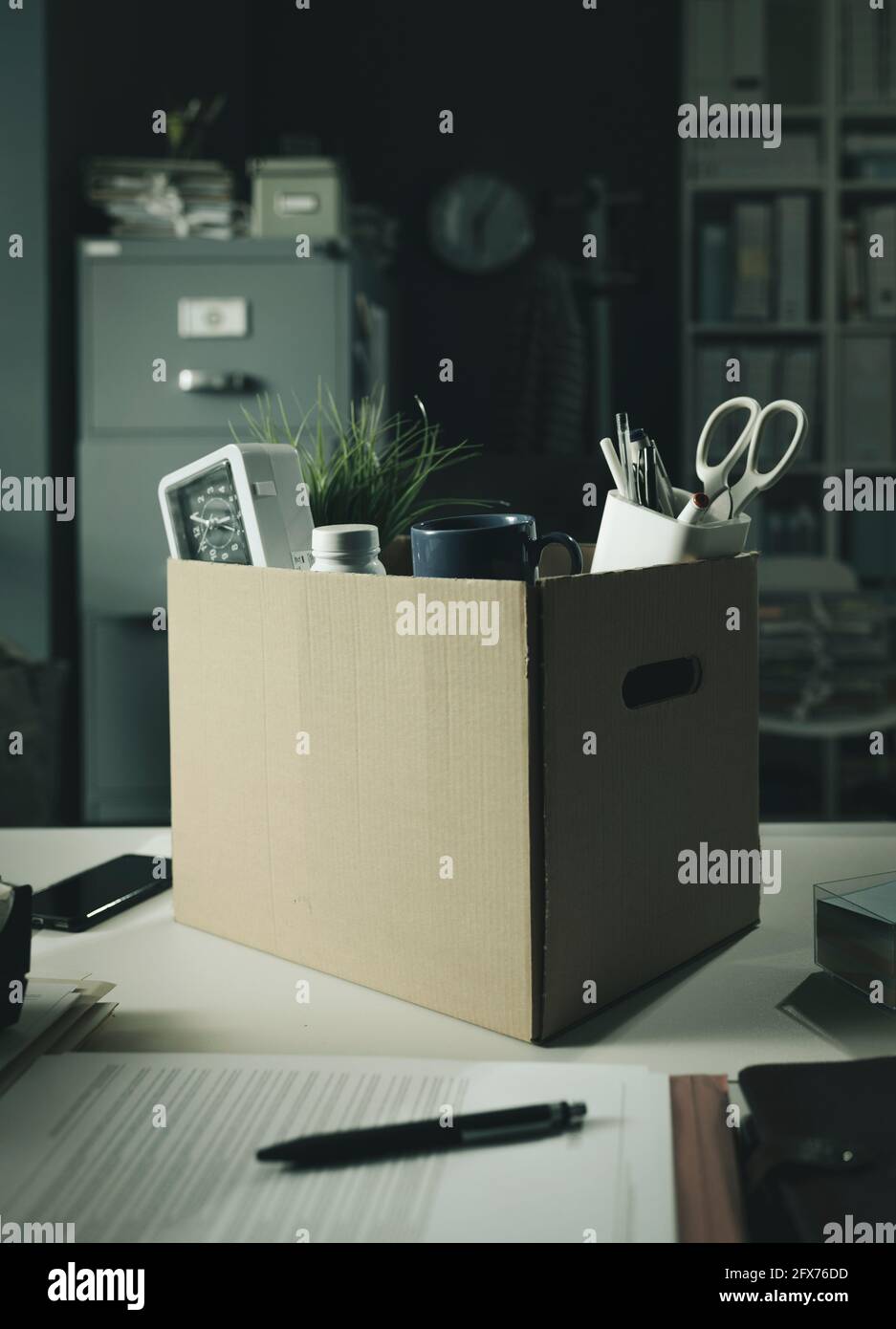 Office worker belongings in a carton box: job dismissal and crisis ...