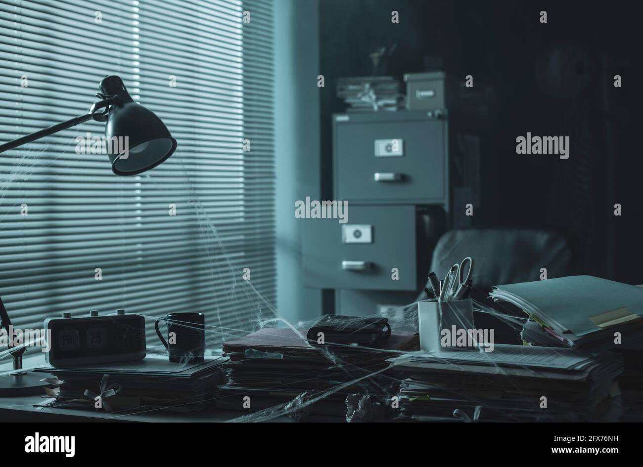 Messy abandoned office after company shut down: the desk is cluttered ...