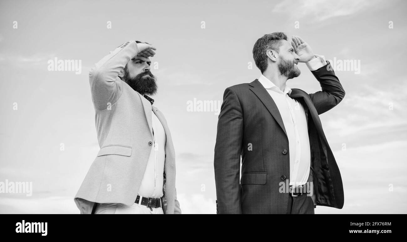 Developing business direction. Businessmen bearded faces stand back to ...