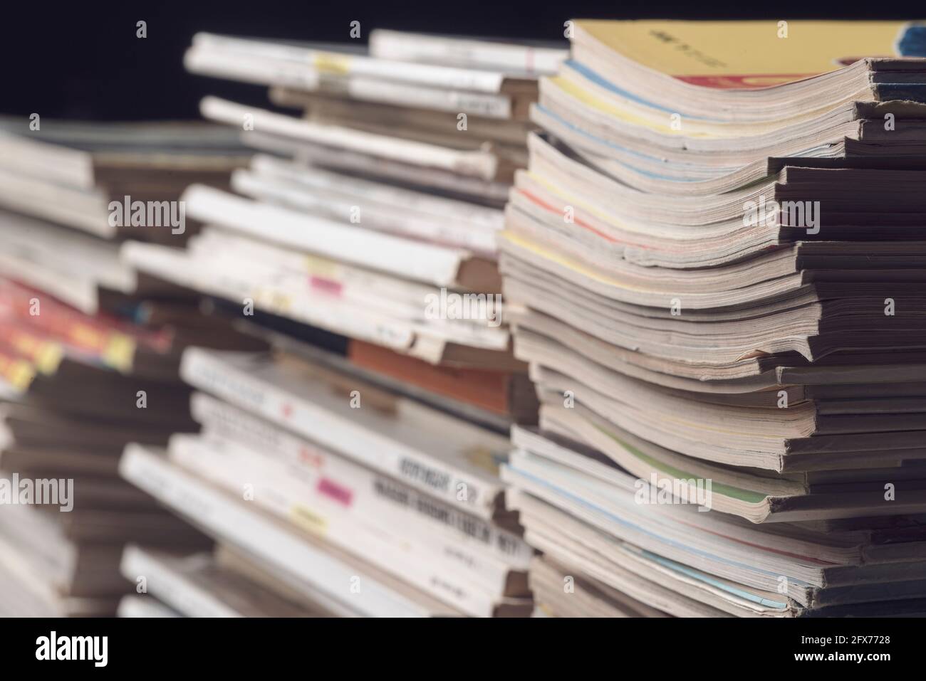 Closeup background of a pile of old magazines Stock Photo - Alamy