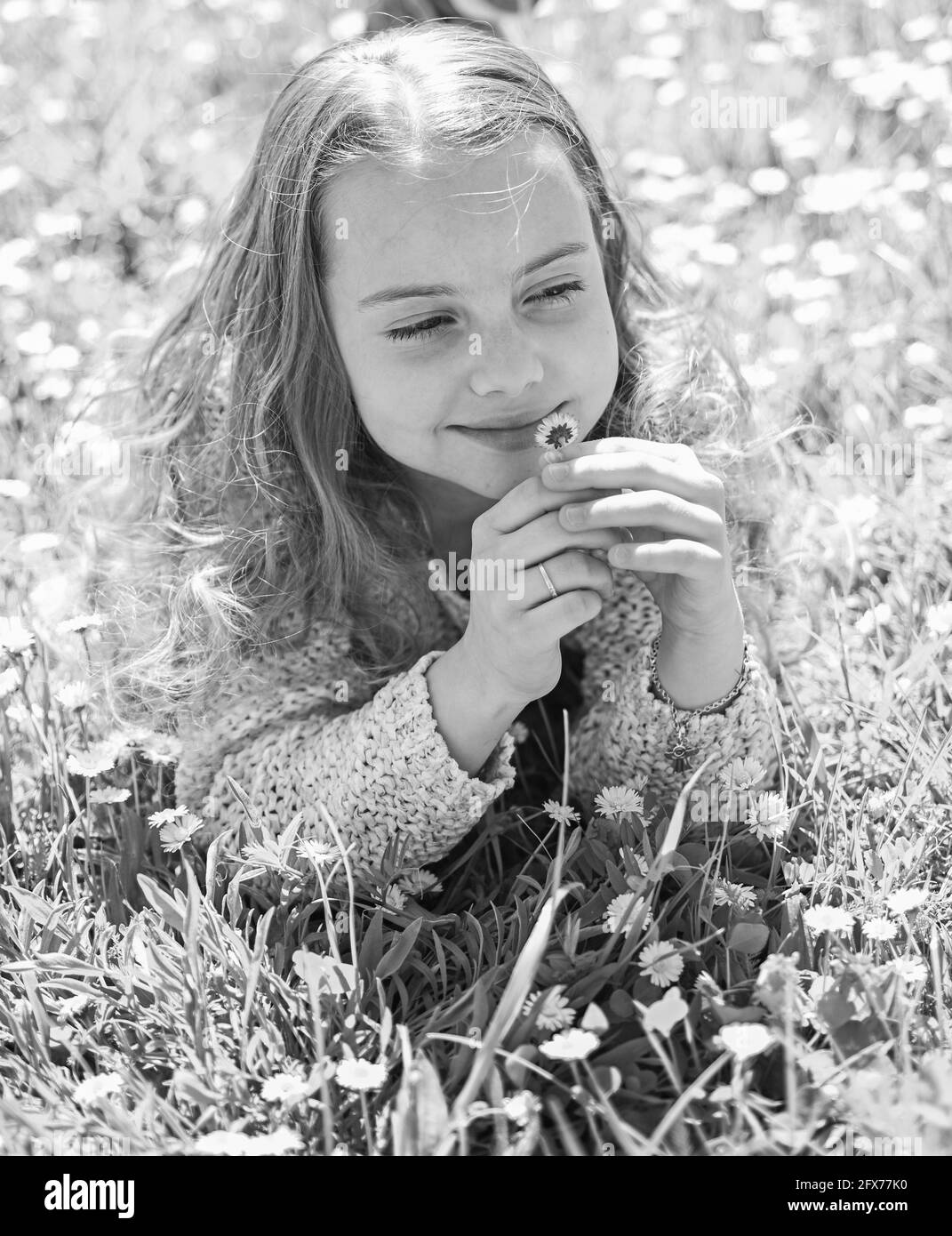 Girl lying on grass, grassplot on background. Sensitivity concept ...