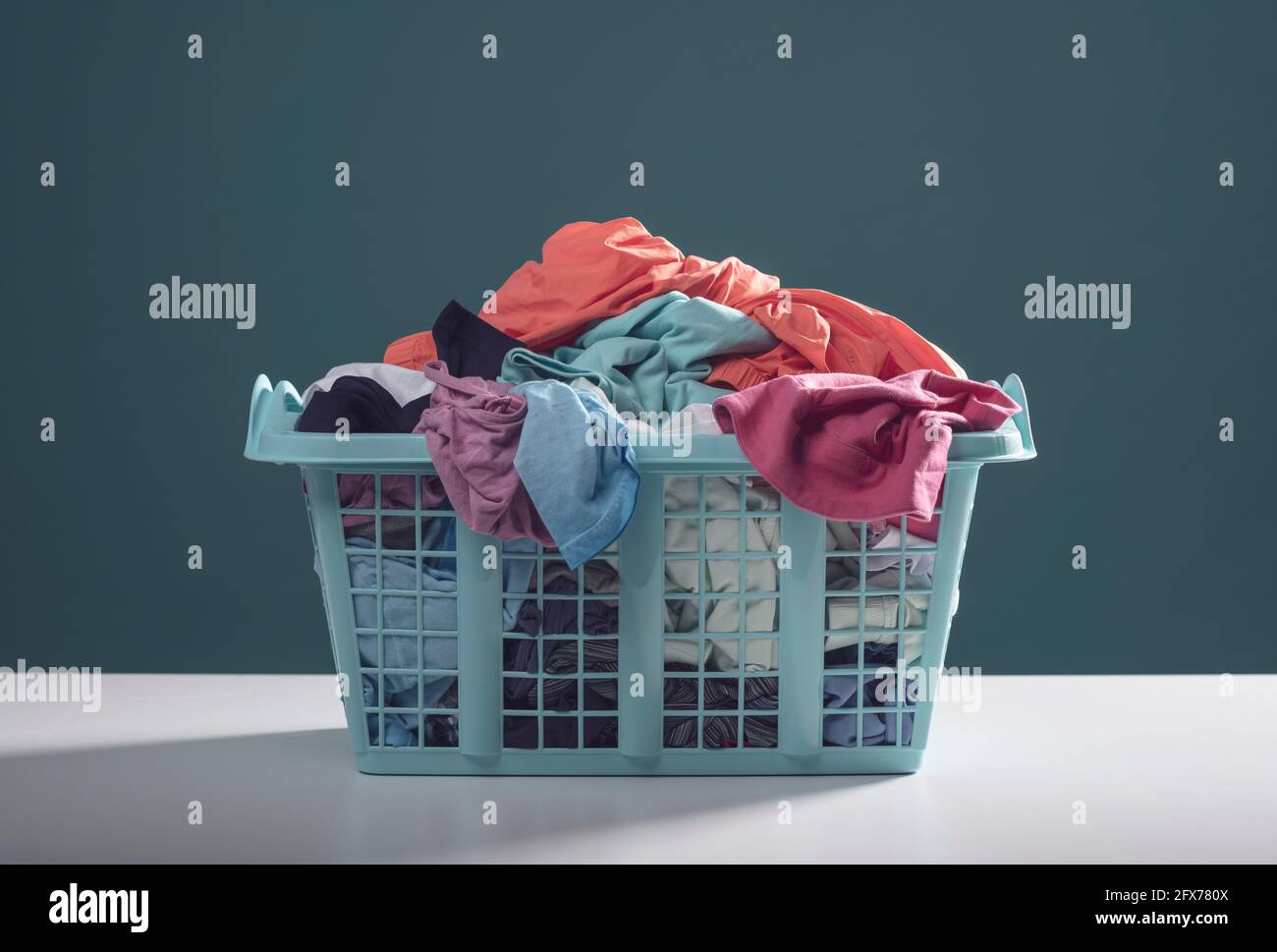 Full laundry basket with dirty clothes, blank copy space Stock Photo ...