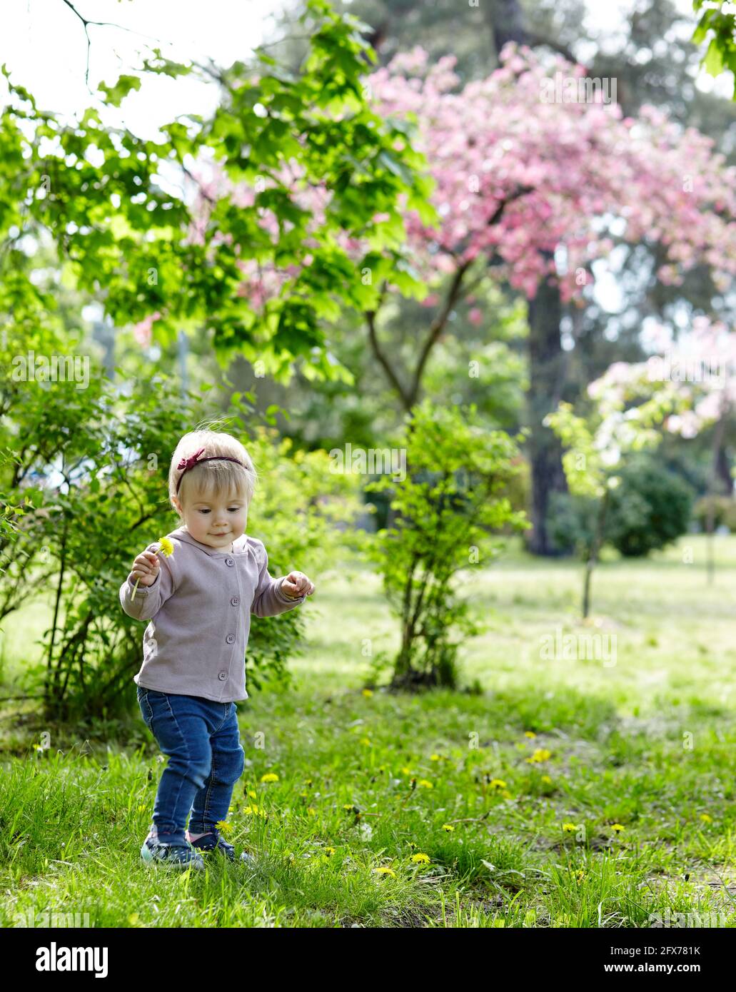 Little girl play in the park and have a good time. The concept of a ...