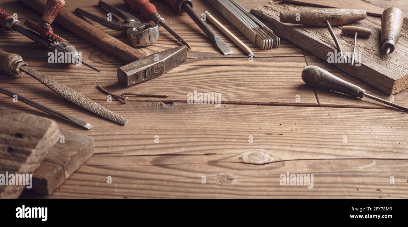 Professional vintage carpentry tools on a rustic wooden table, woodwork ...