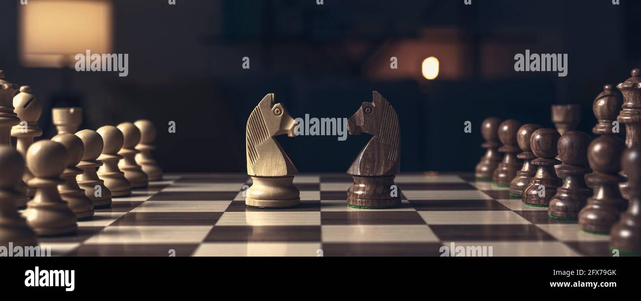 Chess pieces arranged on the chessboard, the knights are facing each ...