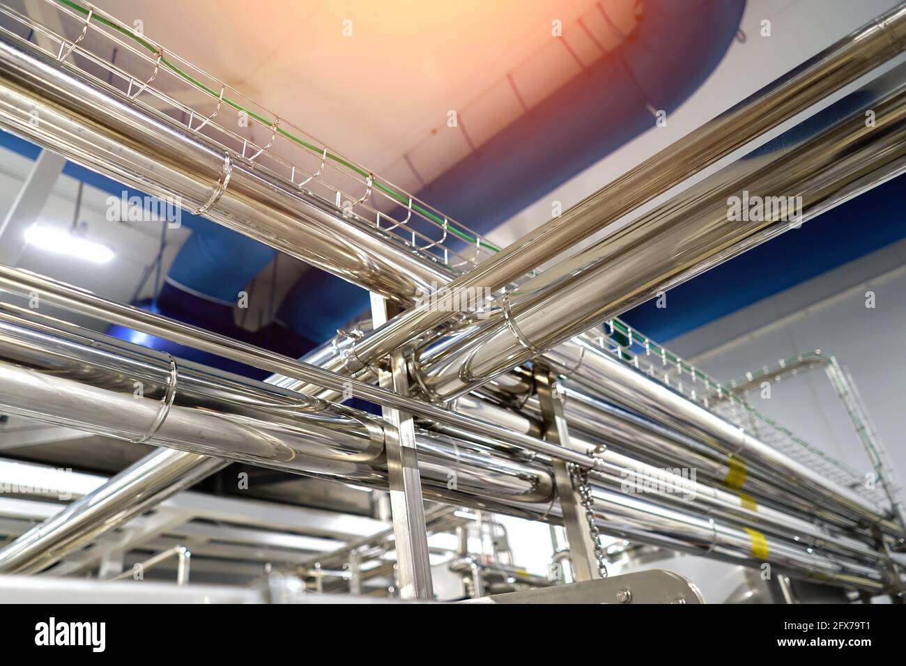 distribution of pipes for pumping liquids at the milk processing plant ...