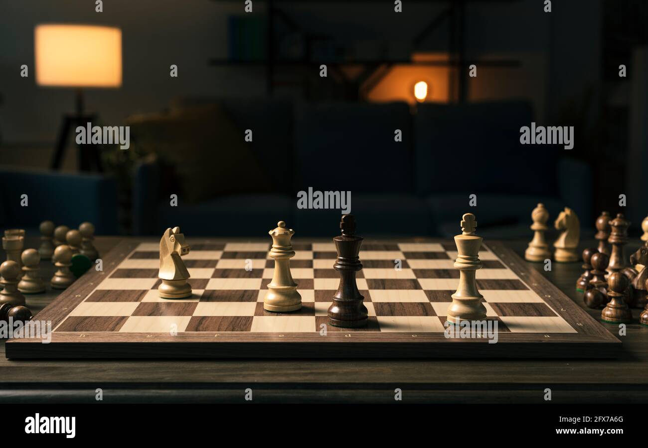 Black king checkmated on the chessboard, strategy games concept Stock ...