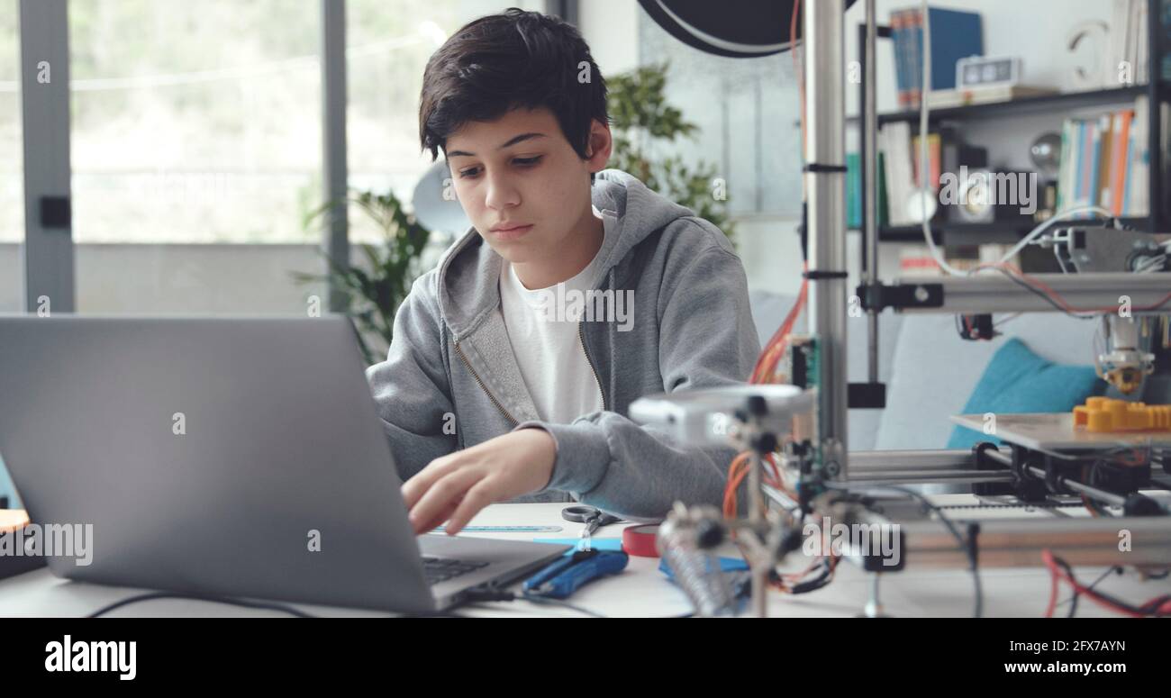 Intelligent student using a 3D printer at home, he is designing a ...