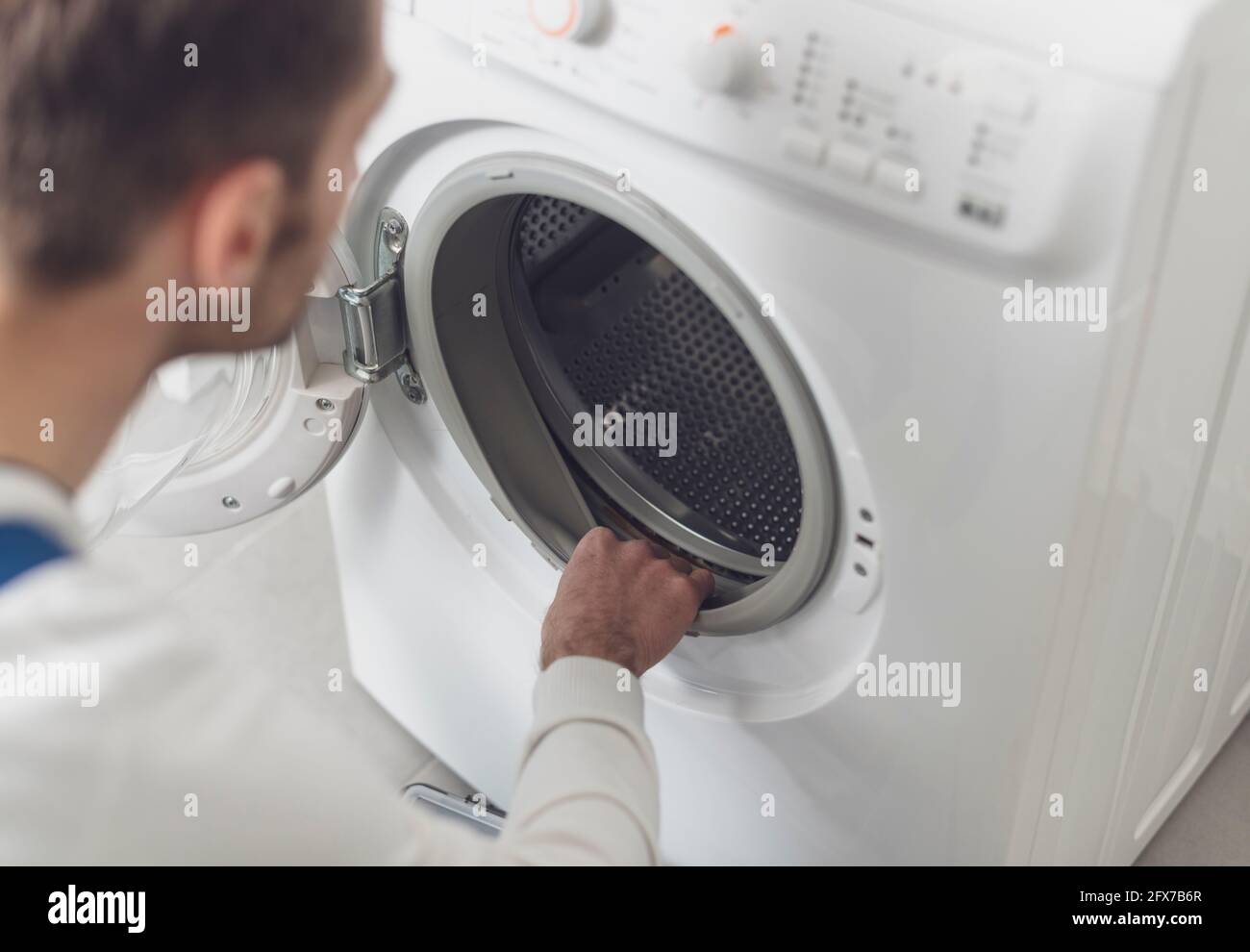 Technician checking door hi-res stock photography and images - Alamy