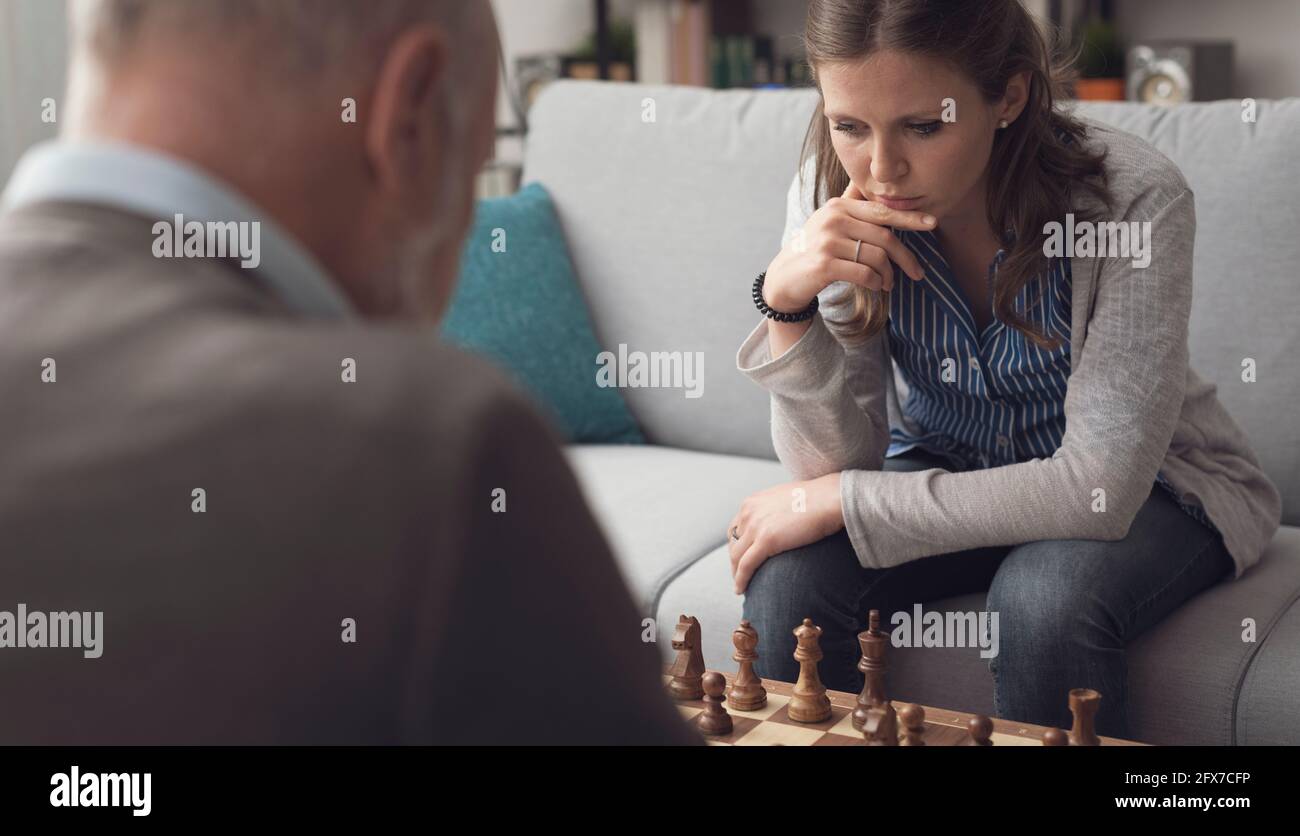 Playing chess in living room hi-res stock photography and images - Alamy