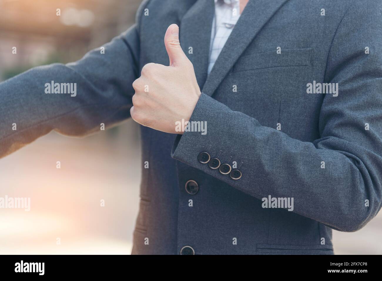 Satisfaction happy businessman showing thumbs up for good work ...