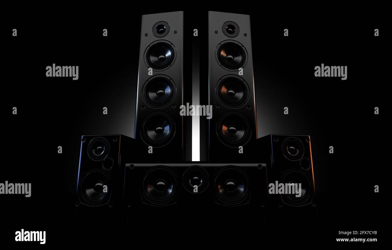 A modern surround sound speaker arrangment on a dark backlit studio ...