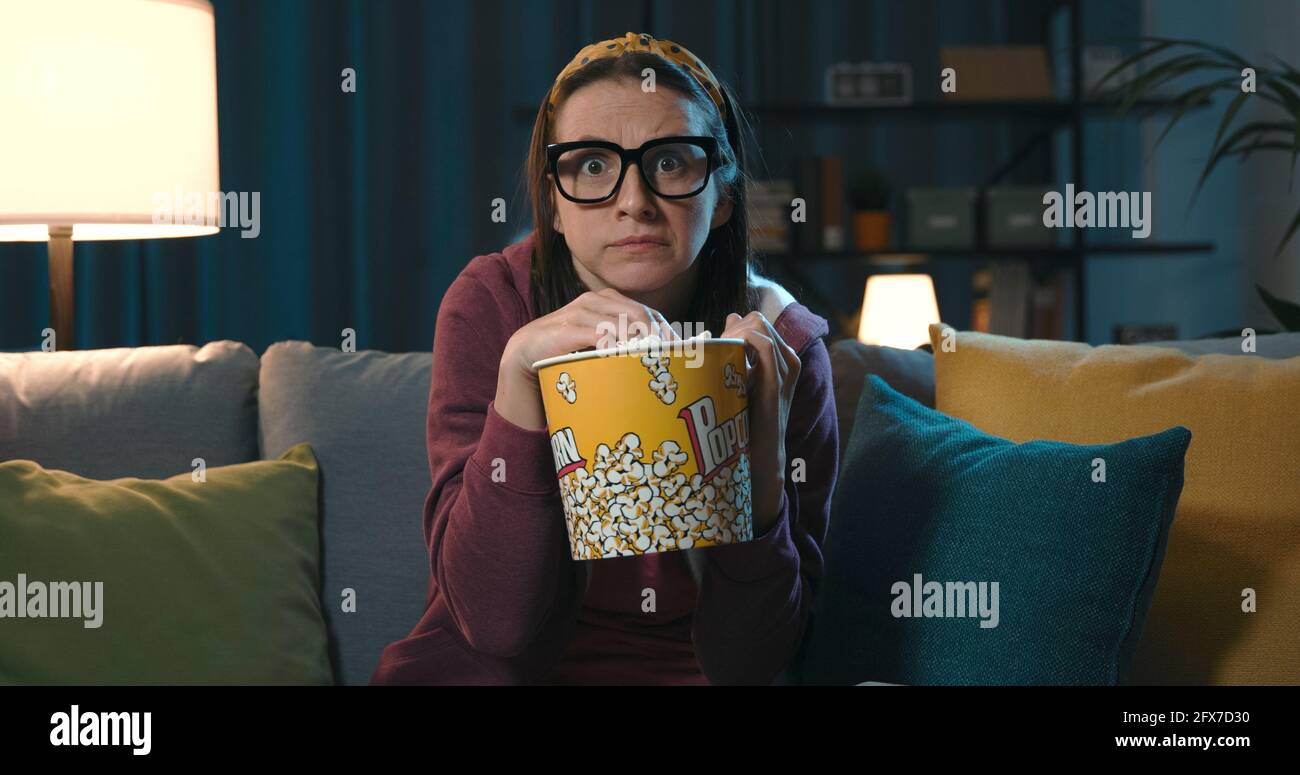 Woman binge eating watching tv hi-res stock photography and images - Alamy