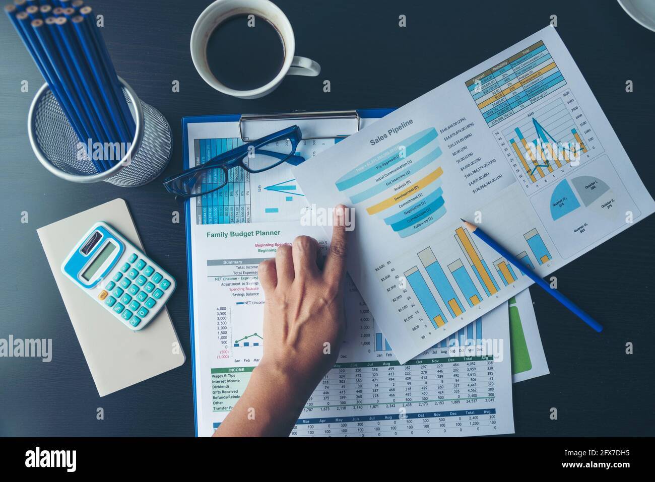 Excel Spreadsheet stats graph analytics data. Accountant hands holding ...