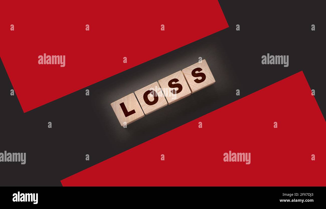 Wooden cubes with LOSS word on blacktable. Financial loss busines ...
