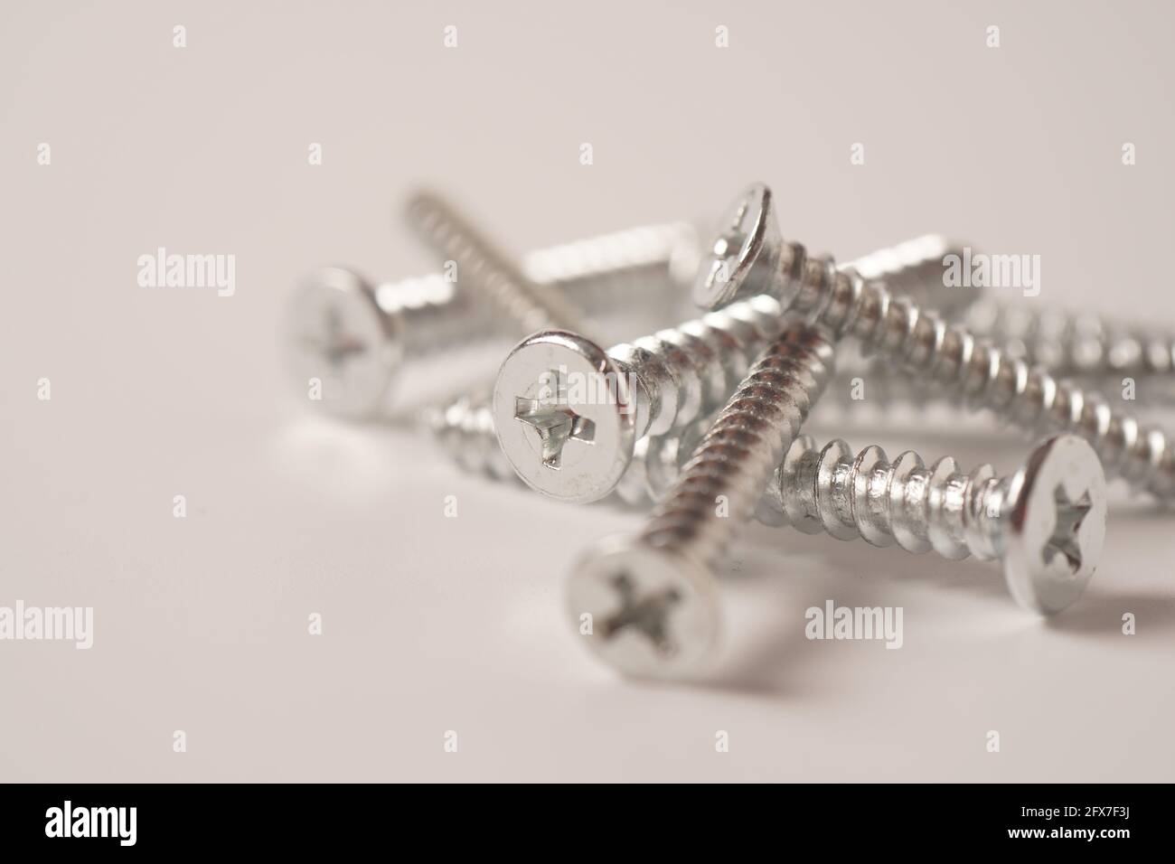 Tapping screws made of steel, metal screws, iron screws isolated on ...