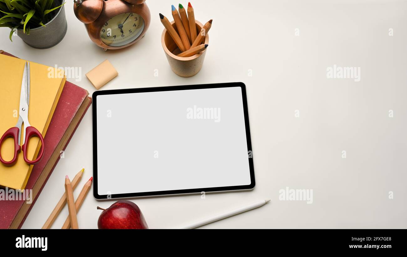 Top view of study table with digital tablet, books and stationery ...