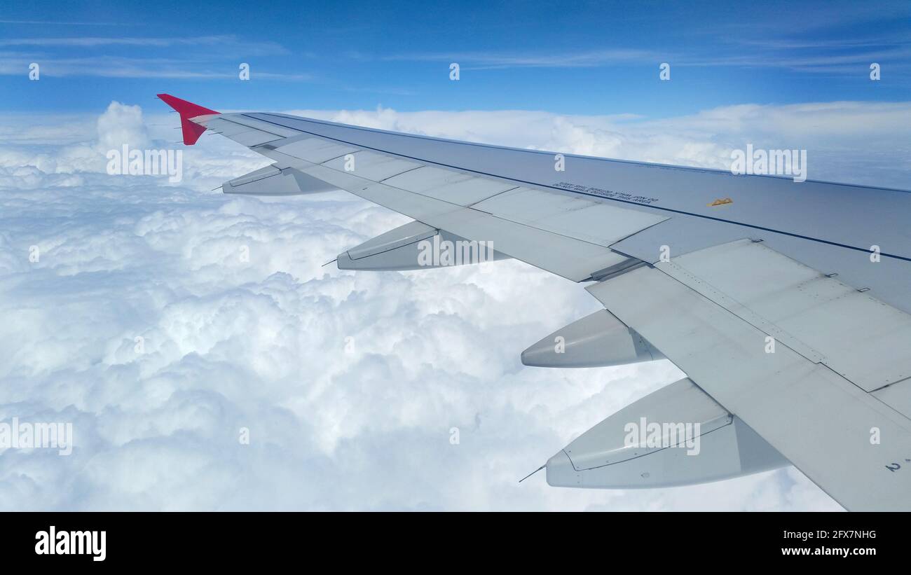 Closeup shot of an airplane wing in the clouds Stock Photo - Alamy