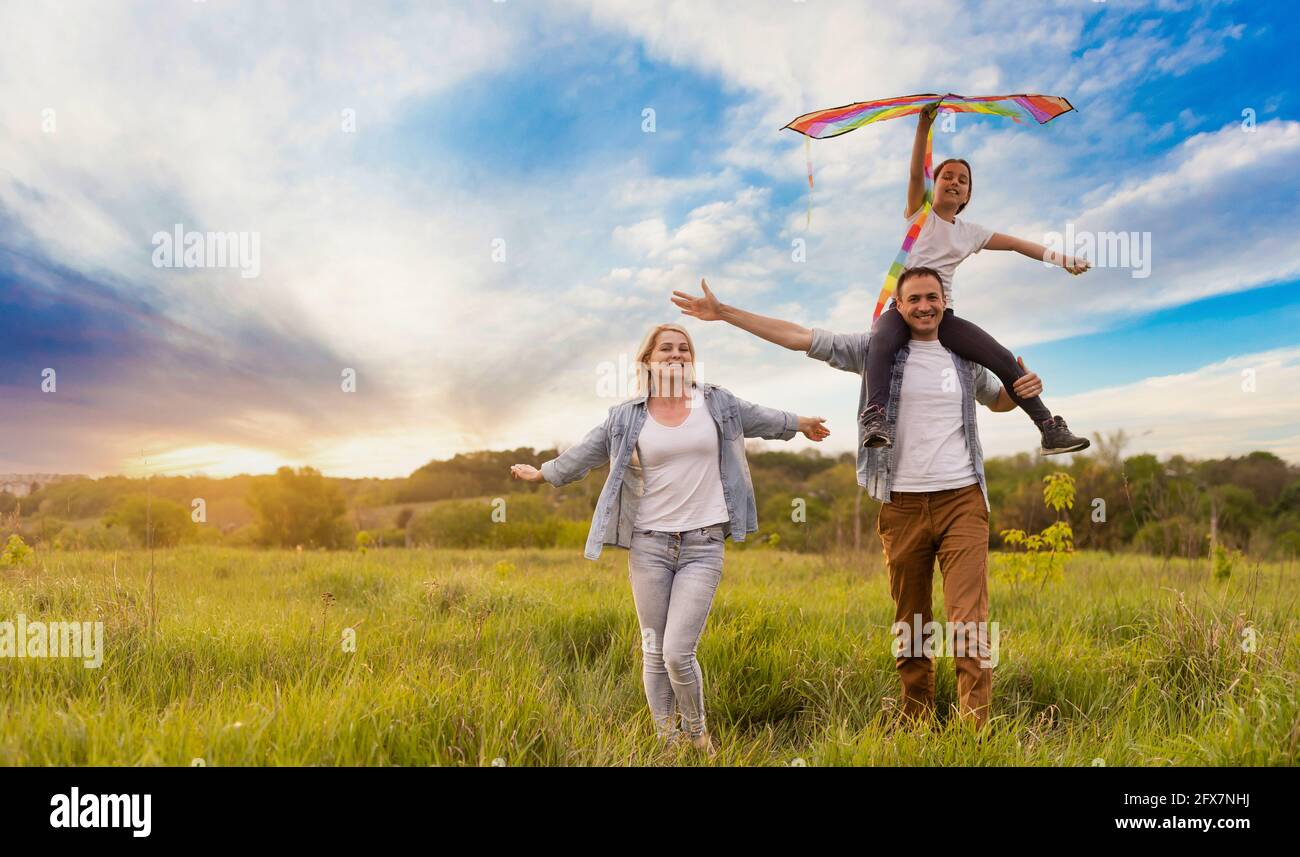 Happy family: mother father and child daughter on nature on sunset ...