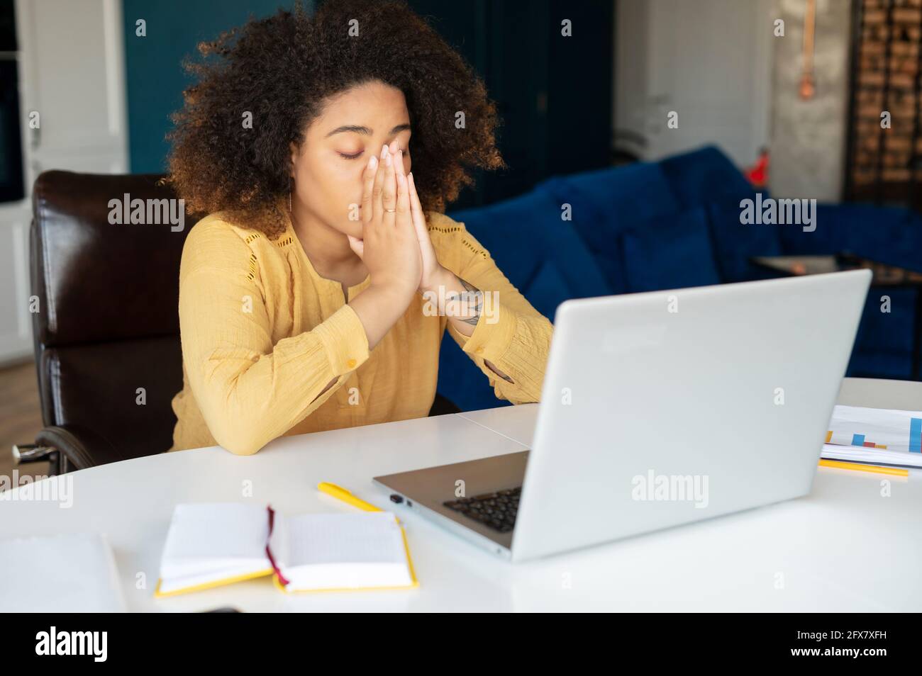 Overworked African-American freelancer woman feels eyes strain due to ...