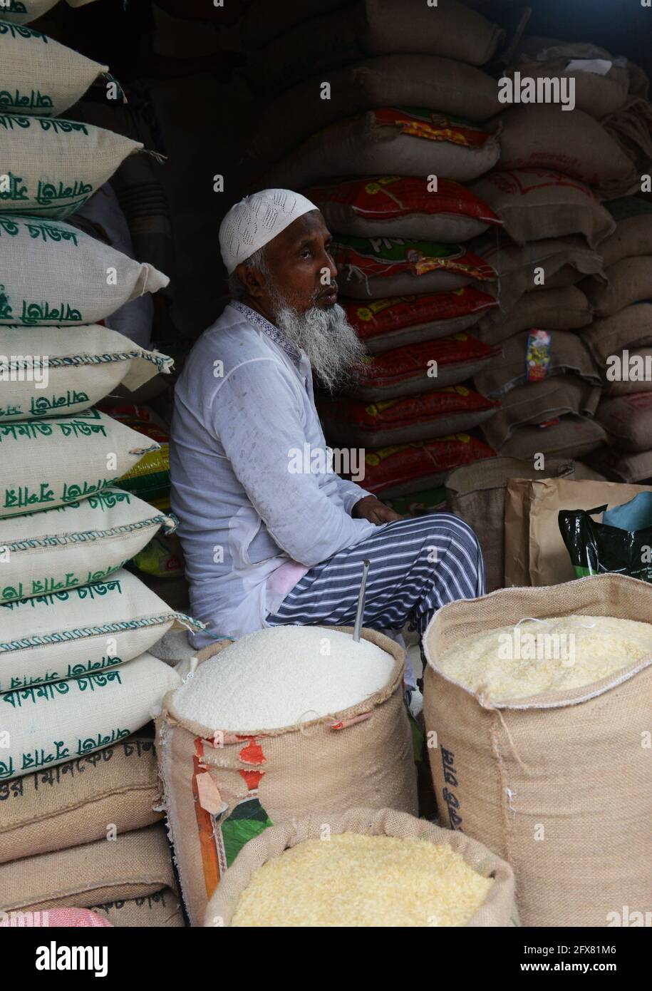 A Bangladeshi rice vendor at the Chawk Bazar in Dhaka, Bangladesh Stock ...