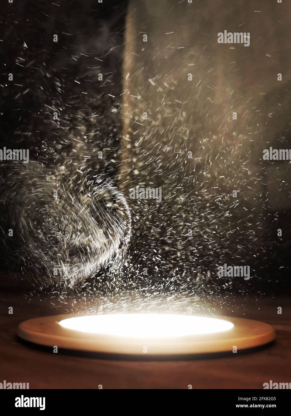 Vertical shot of moving dust particles in a light ray Stock Photo - Alamy