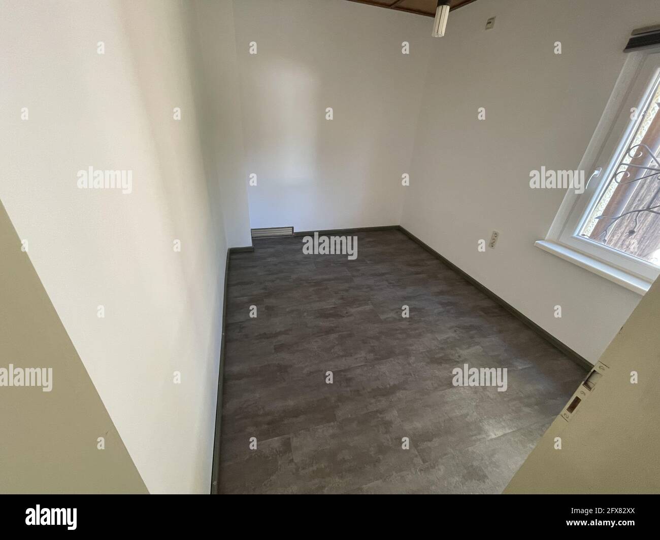 High angle shot of a newly renovated empty room with a window Stock ...