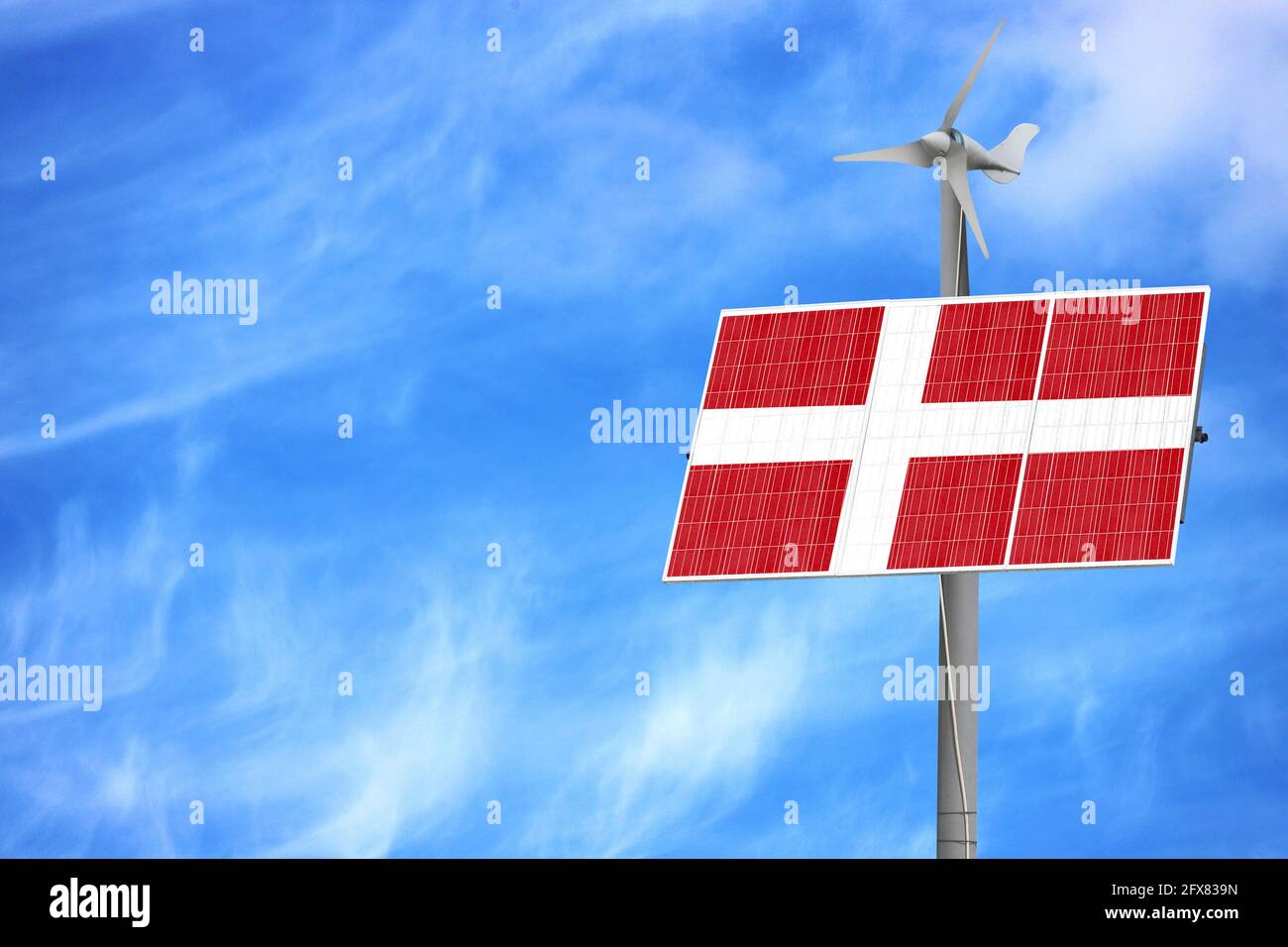 Solar panels against a blue sky with a picture of the flag of Denmark ...