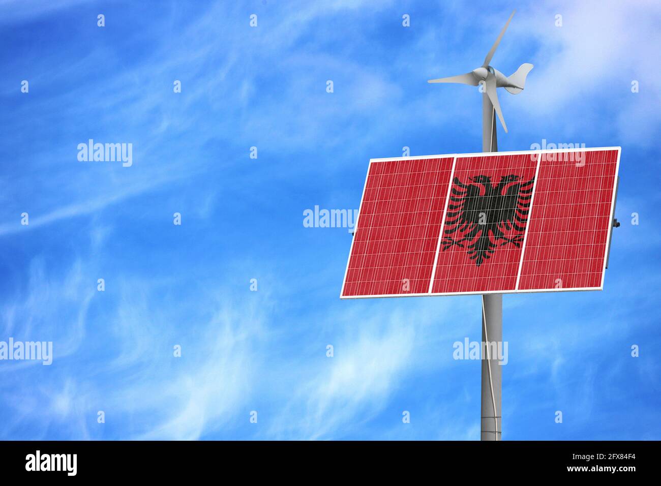 Solar panels against a blue sky with a picture of the flag of Albania ...