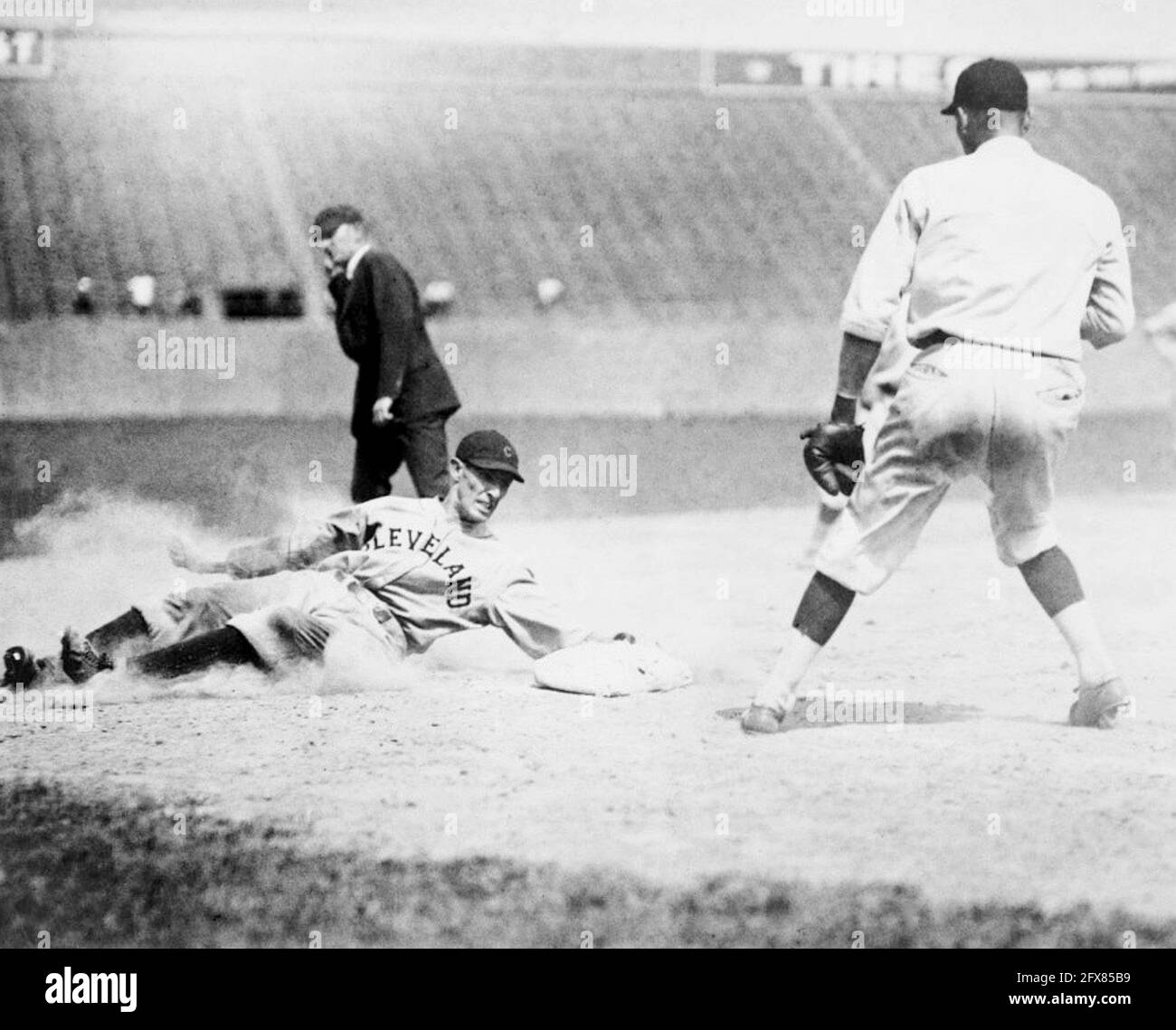 Chick Fewster, Cleveland Indians, slides safely into 3rd base during ...