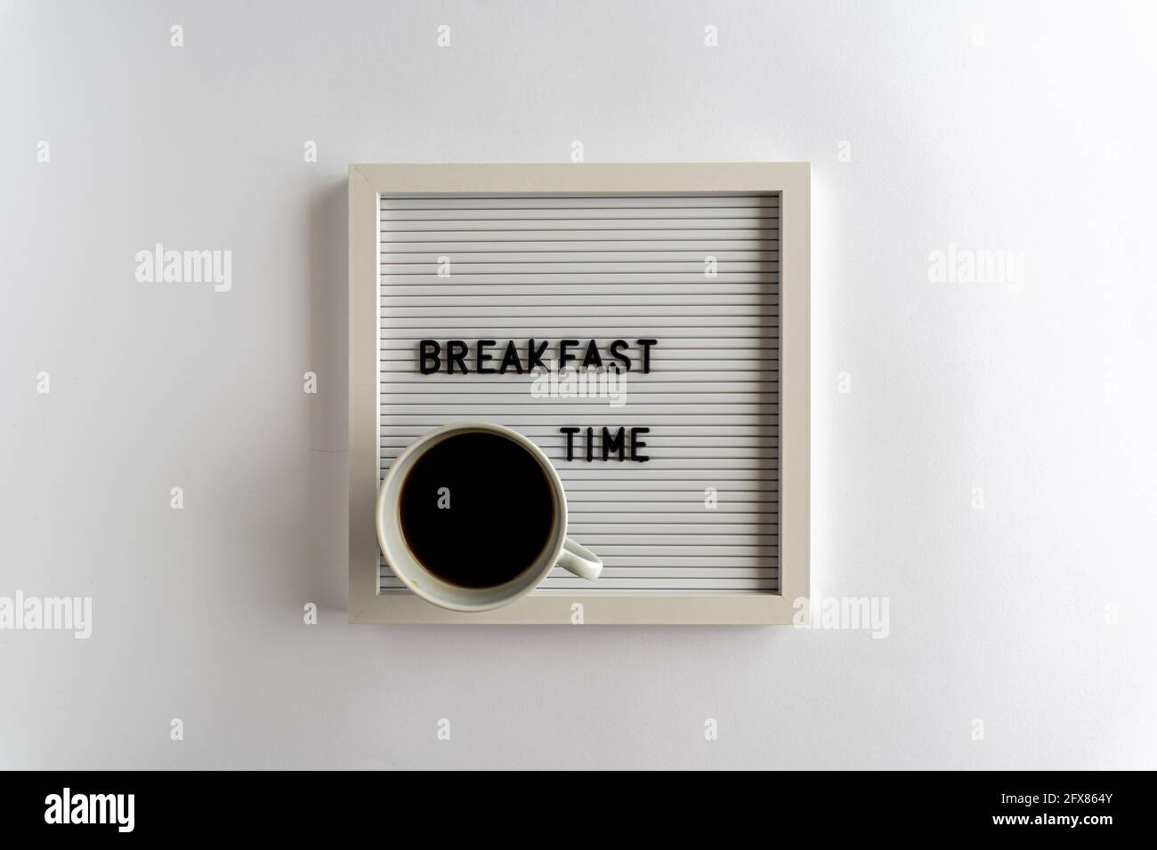Letterboard With Words That Spell Breakfast Time, with a cup of coffee ...
