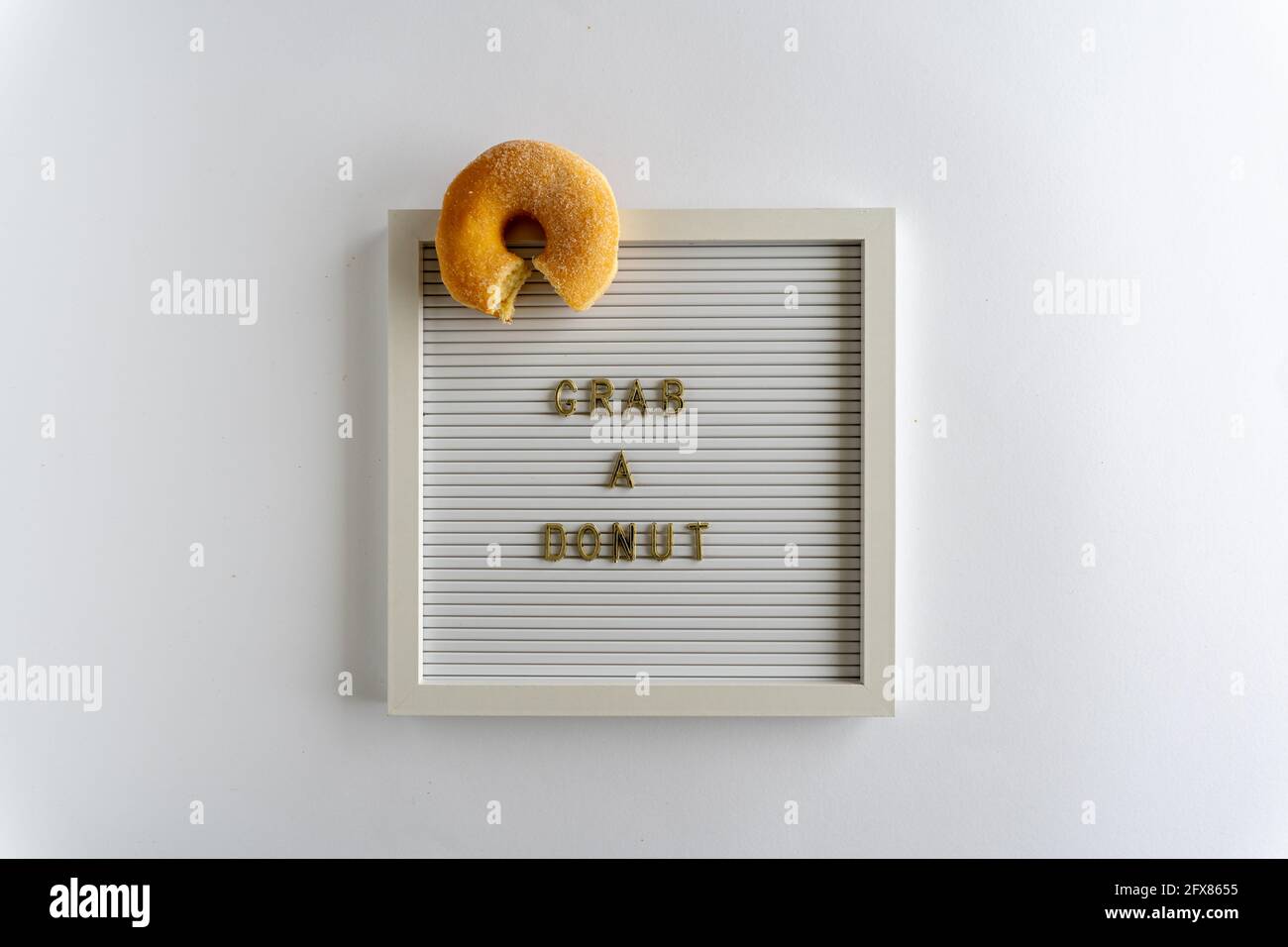 Letterboard With Words That Spell Gran A Donut , with a fresh donut, in ...