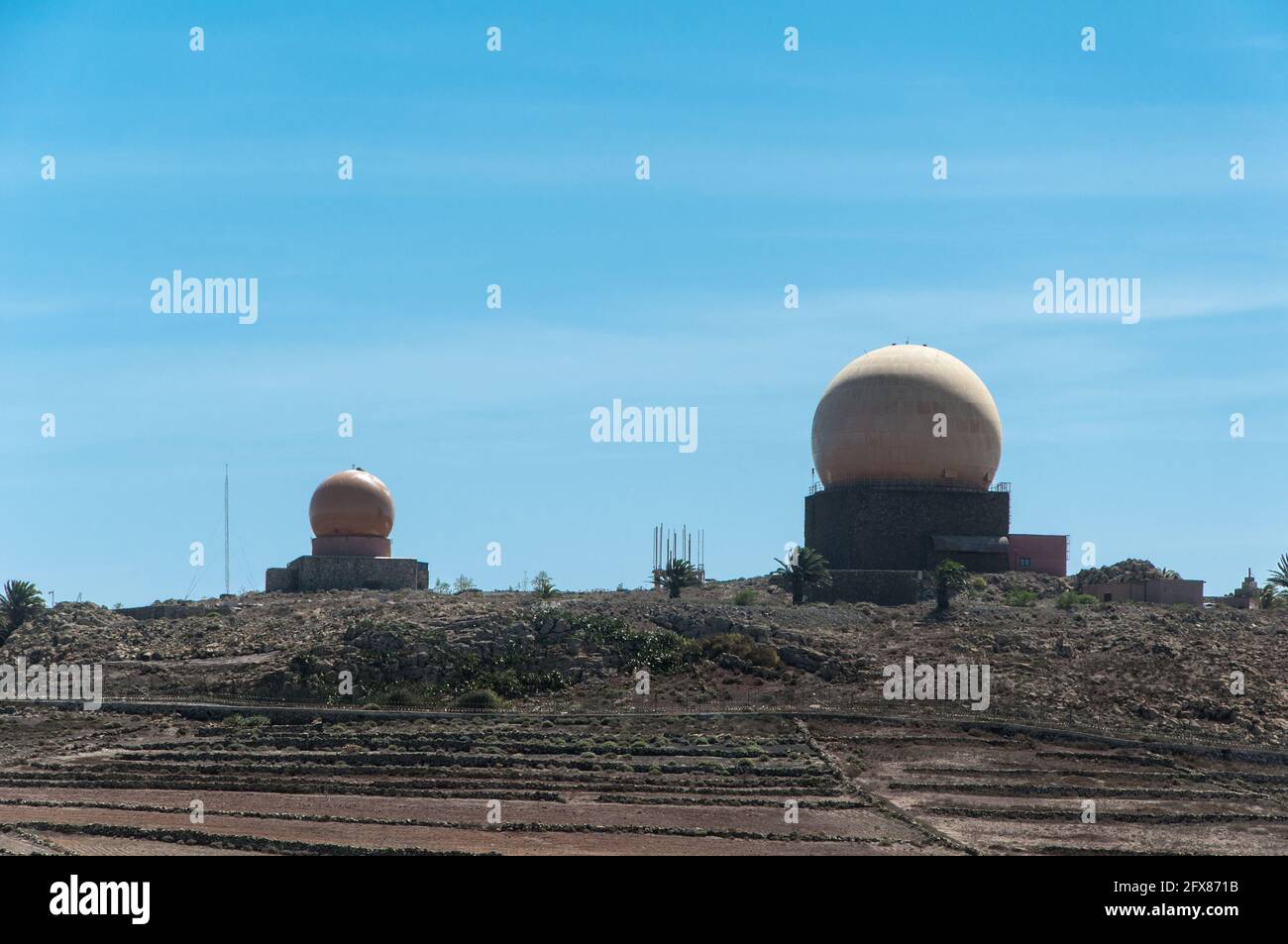 Two astronomical observatories in a field under the clear sky Stock ...