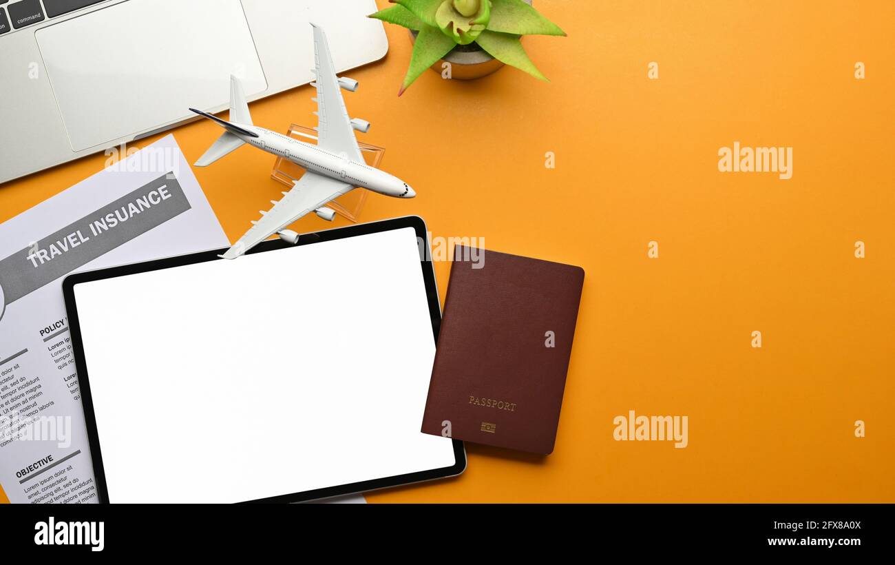 Creative flat lay workspace in travel concept with digital tablet ...