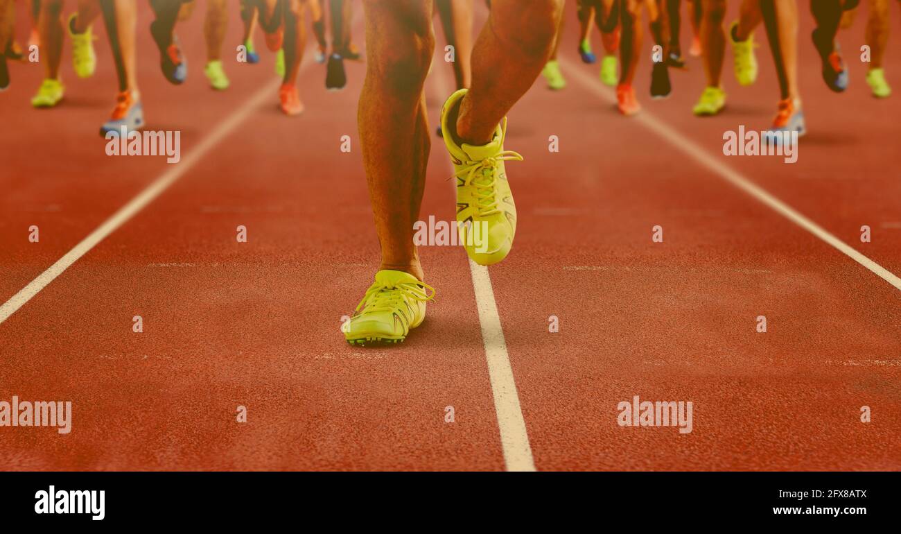 Composition of legs of running male athletes on racing track Stock ...