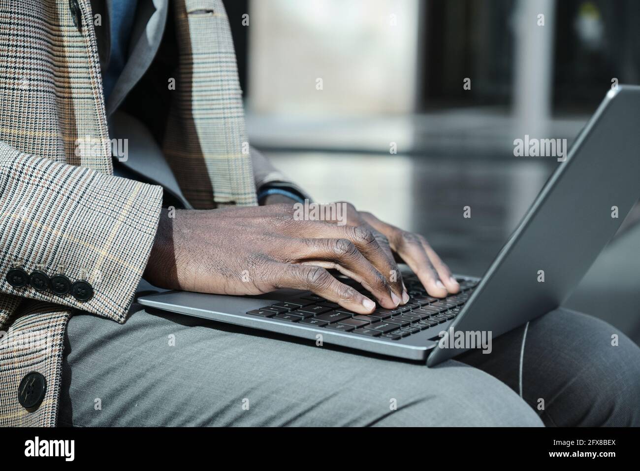 Typing mid adult african hi-res stock photography and images - Alamy