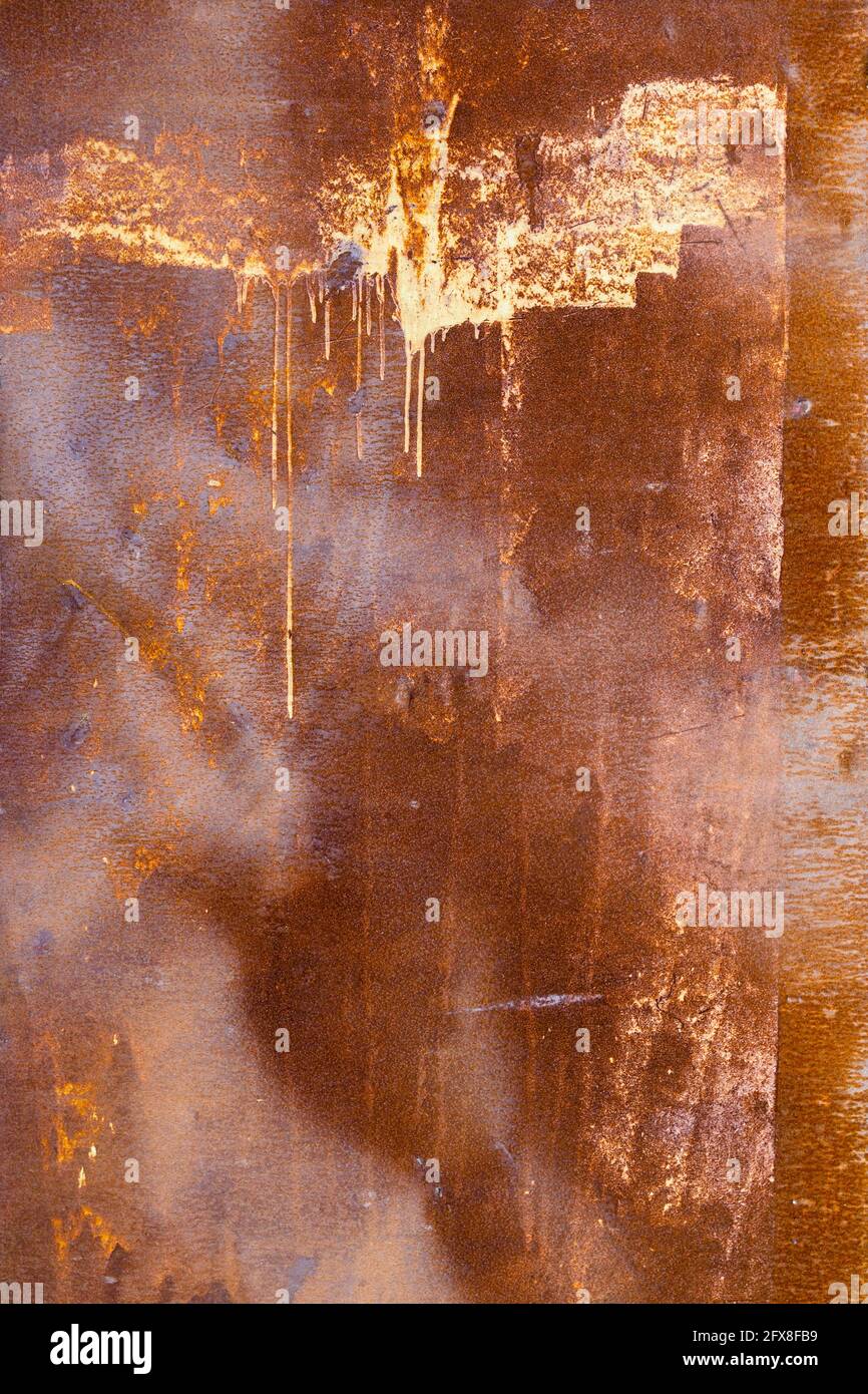 rusted flat solid sheet metal background and texture with leftovers of ...