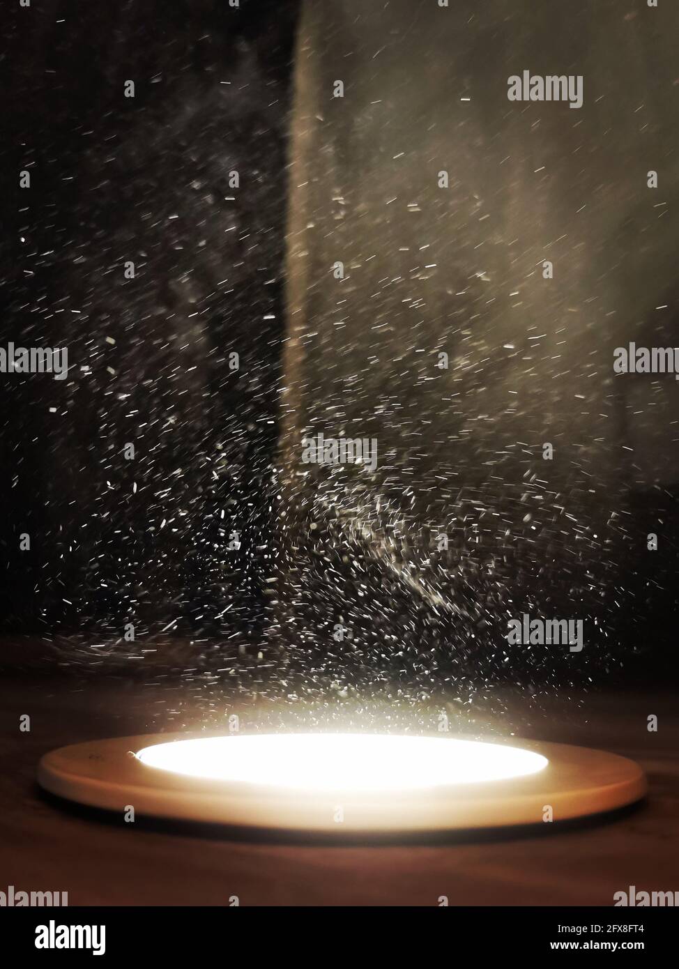 Vertical shot of moving dust particles in a light ray Stock Photo - Alamy