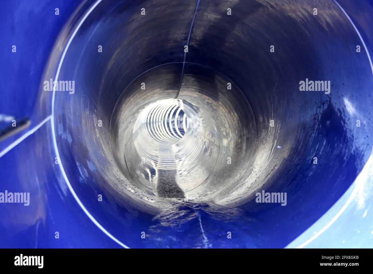 Blue slide in a water park Stock Photo - Alamy